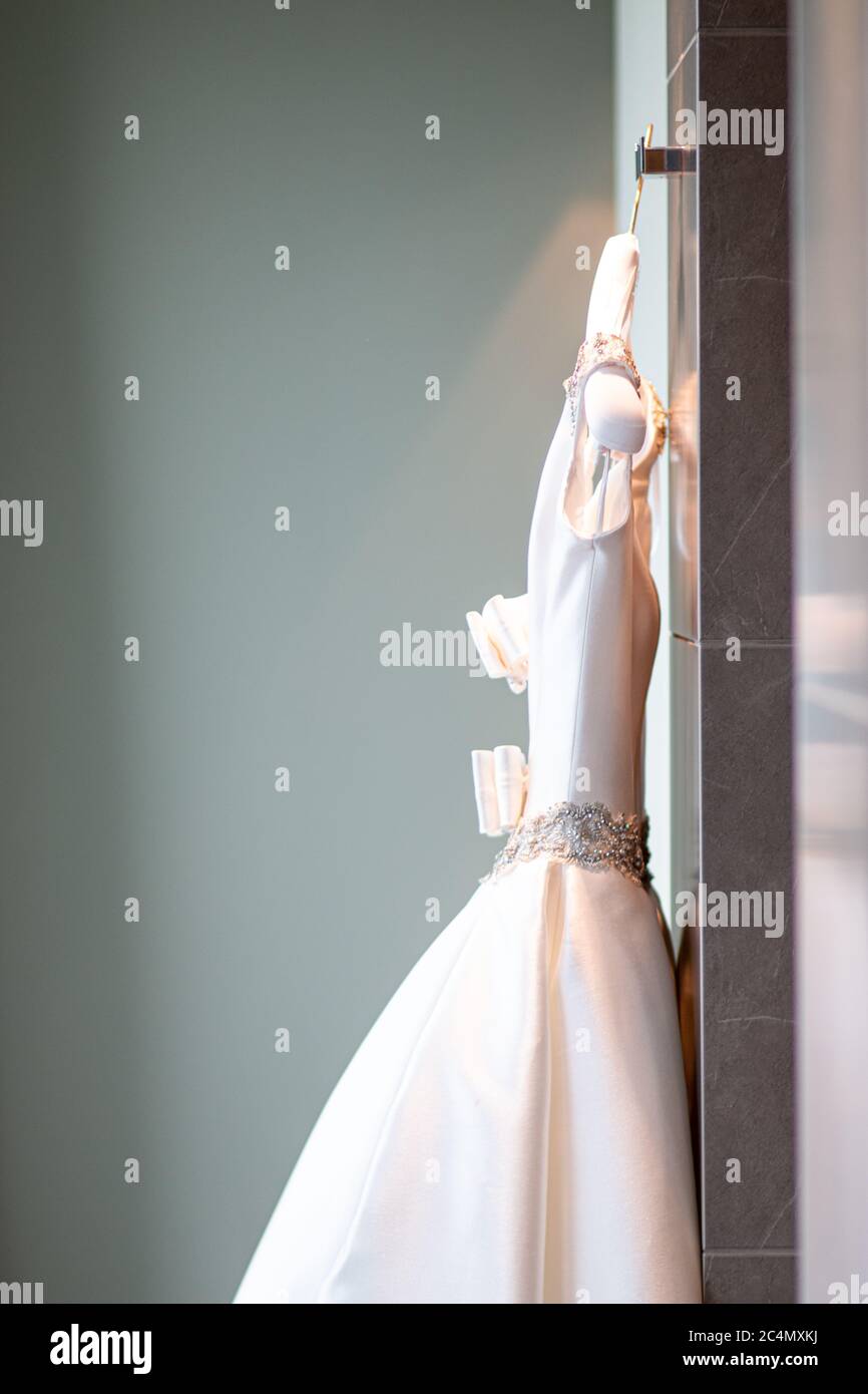 wedding dress bridal dress hanging outfit hanger getting ready Stock ...