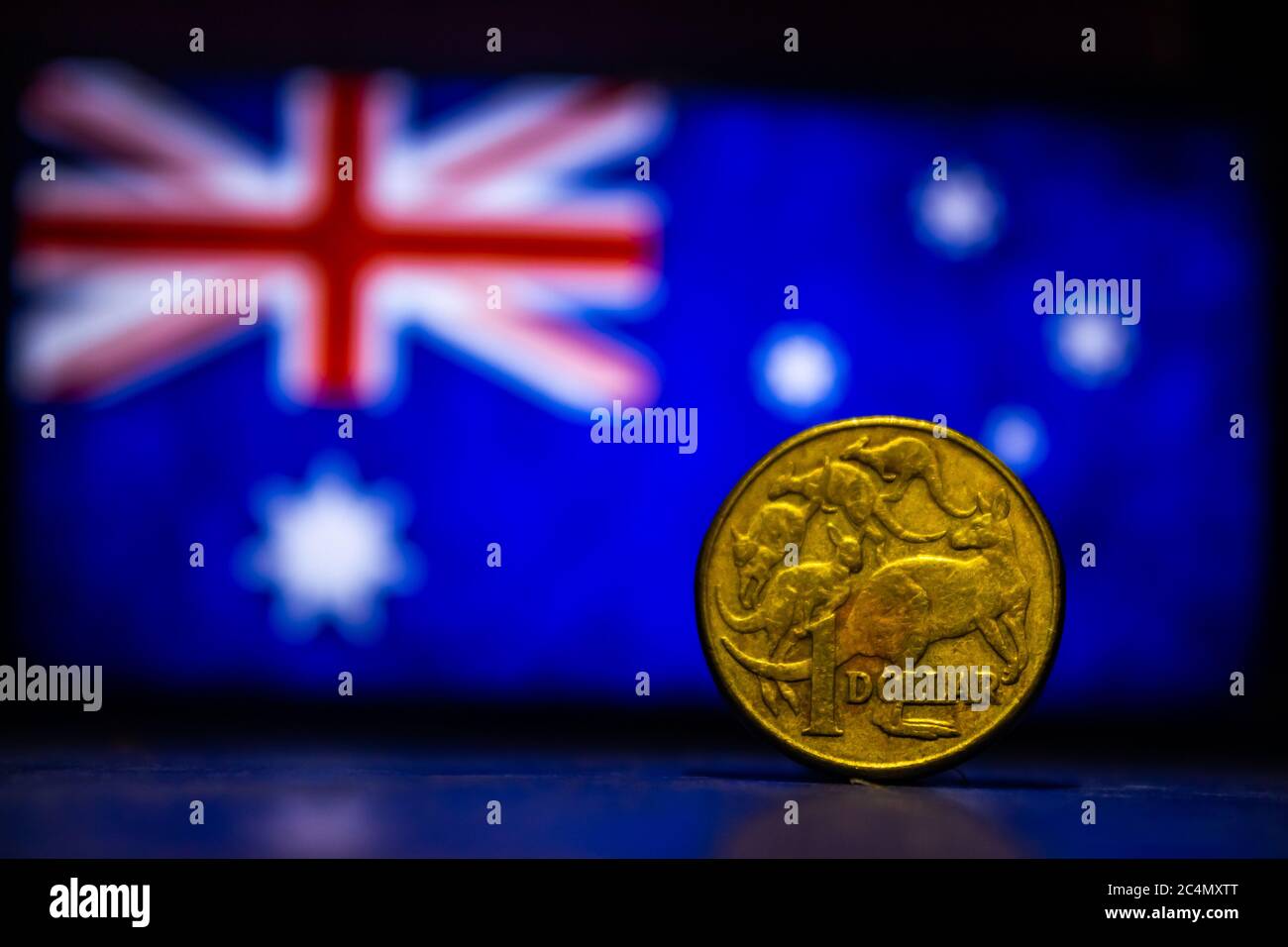 Australian dollar coin isolated on Australia flag background with space ...
