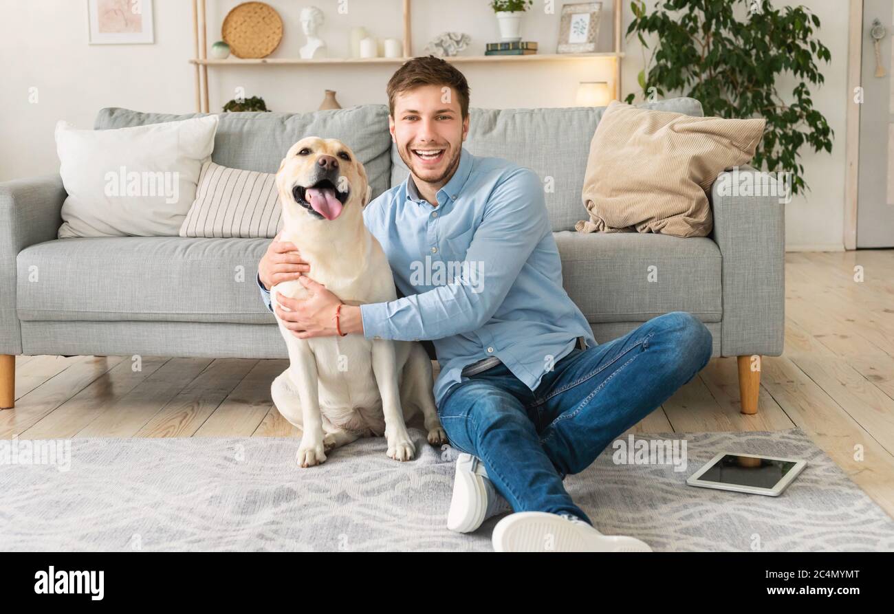 Happy guy with dog hi-res stock photography and images - Alamy