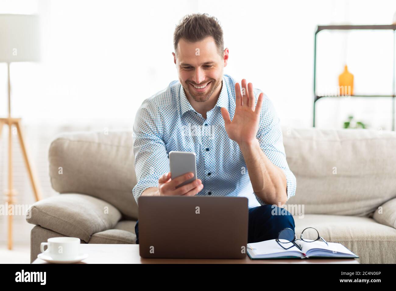 Handsome guy using mobile hi-res stock photography and images - Alamy