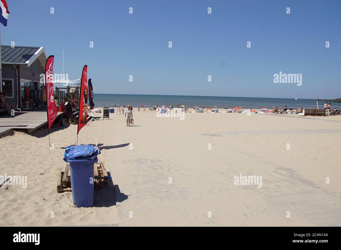 Sandy beach at the Dutch coastal village of Bergen aan Zee. People ...