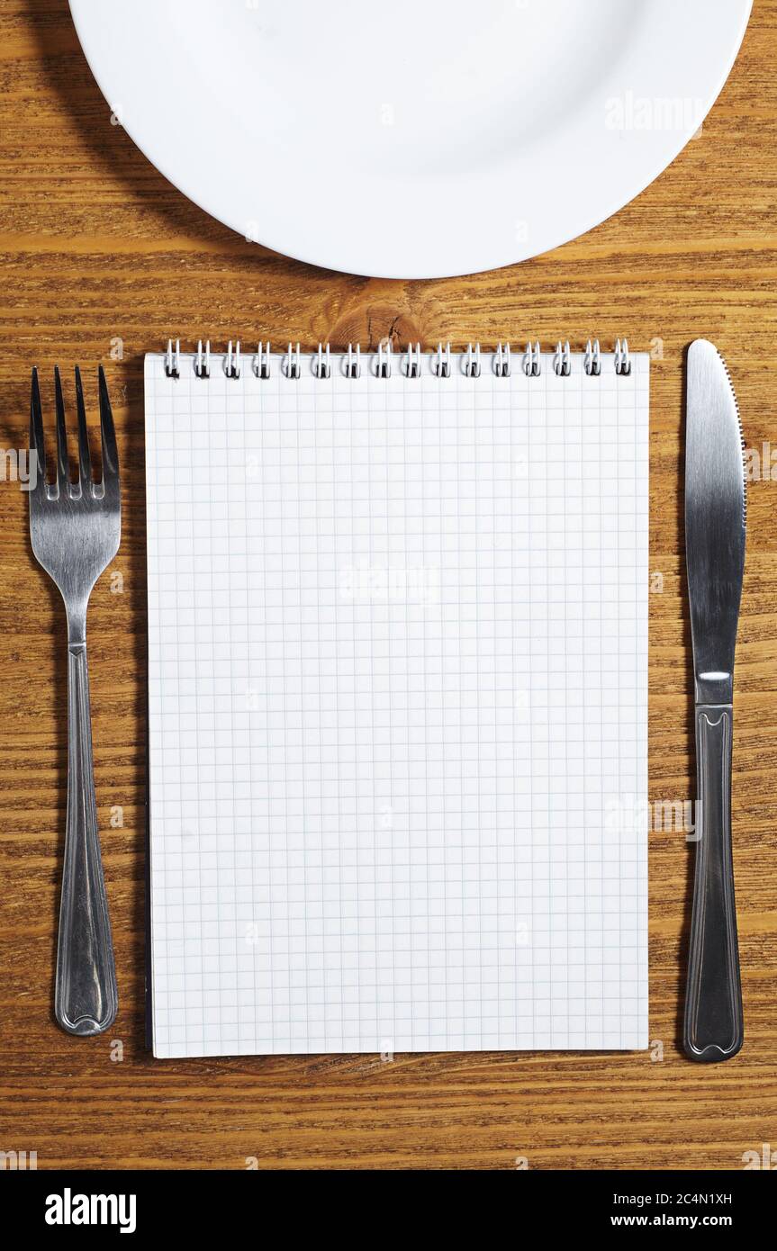 Notepad and cutlery. You can use as a template for a menu of cafes and ...