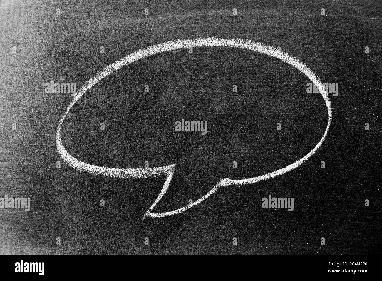 White color chalk hand drawing in round bubble speech shape with blank ...