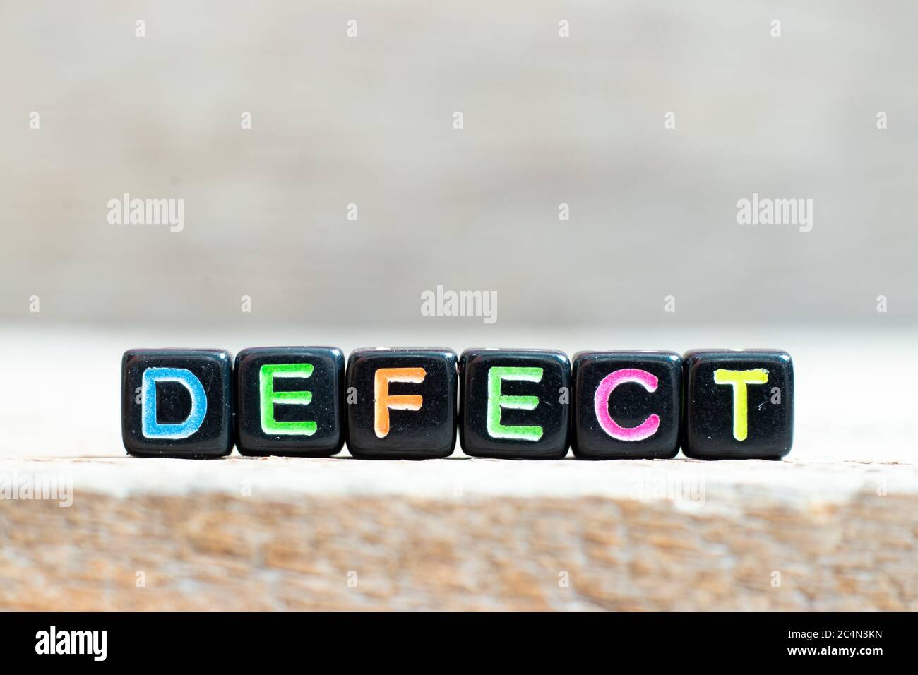 Black bead with color letter in word defect on wood background Stock ...