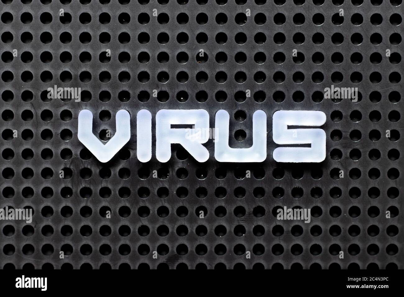 White color alphabet with word virus on black pegboard background Stock ...