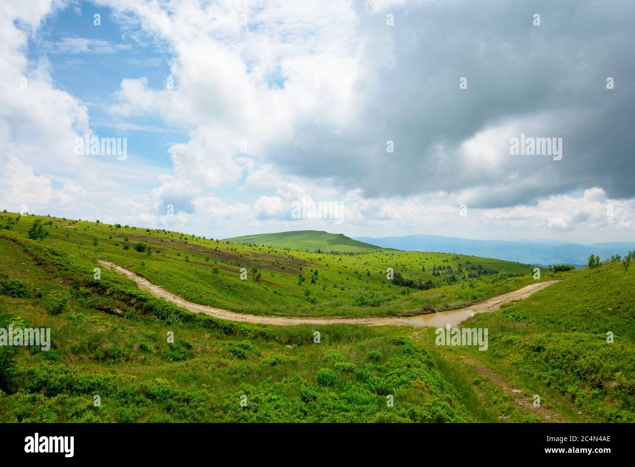 path through mountain landscape. road through green rolling hills ...