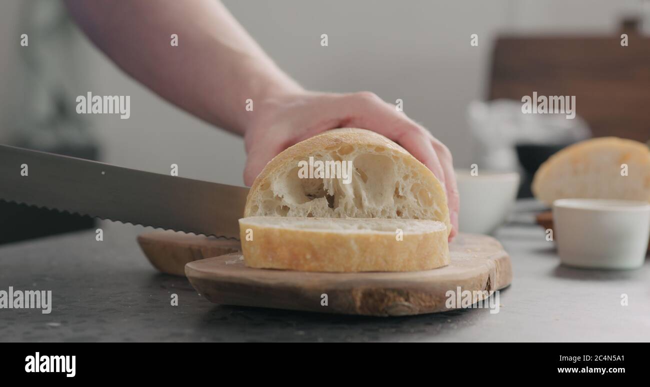Man cutting bread hi-res stock photography and images - Alamy
