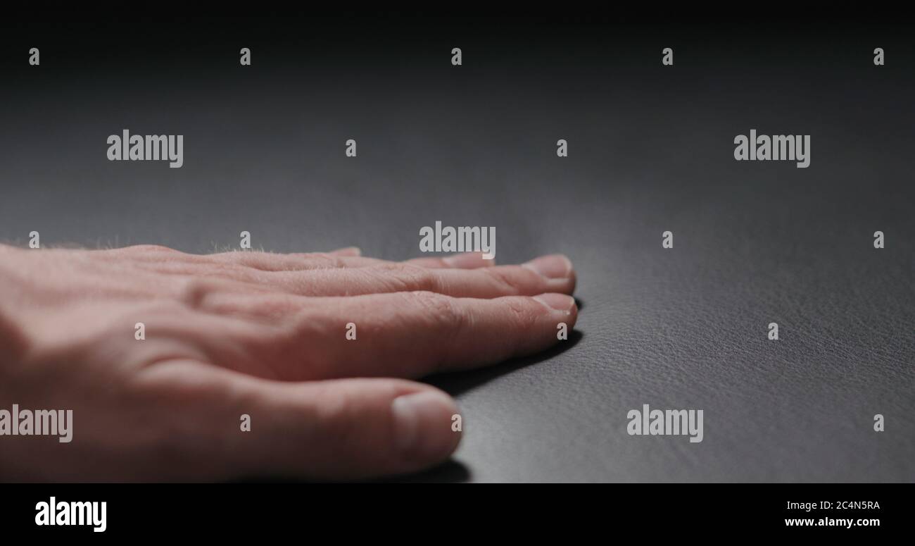 Young man hand touch real full grain leather Stock Photo - Alamy