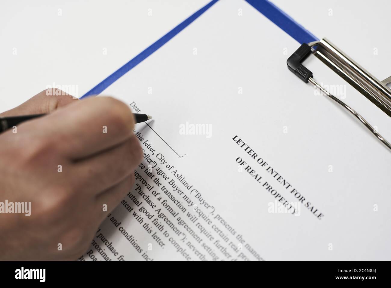 Closeup shot of a person filling in a legal document Stock Photo - Alamy