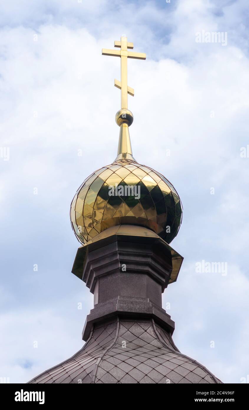 bottom view domes of christian church with crosses on blue sky ...