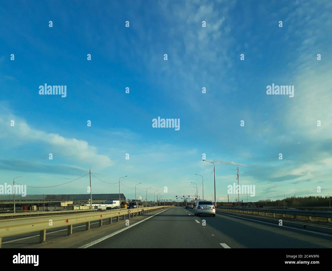 A road or highway leading to the horizon. View from the car window ...