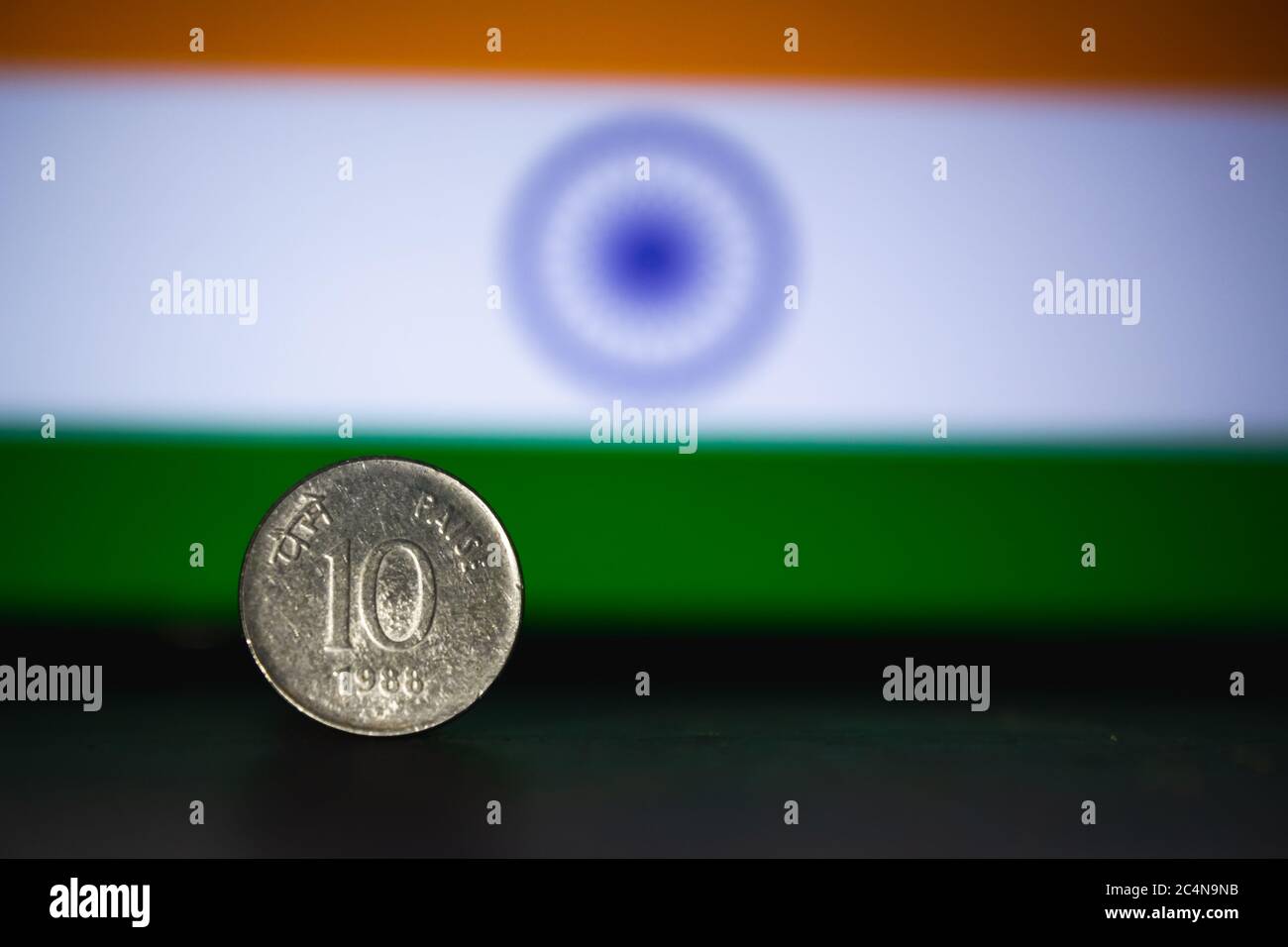 Indian currency - Indian 10 Paisa coin rupee isolated on india flag ...
