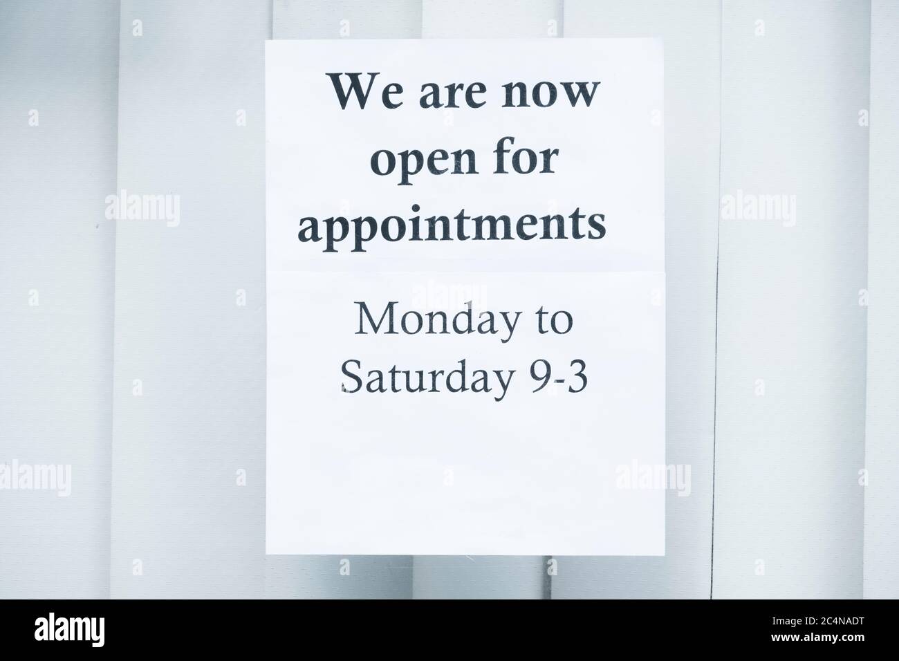 Social distancing sign for shop customer queue Stock Photo - Alamy