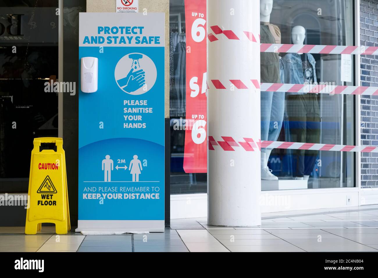 Social distancing sign for shop customer queue Stock Photo - Alamy