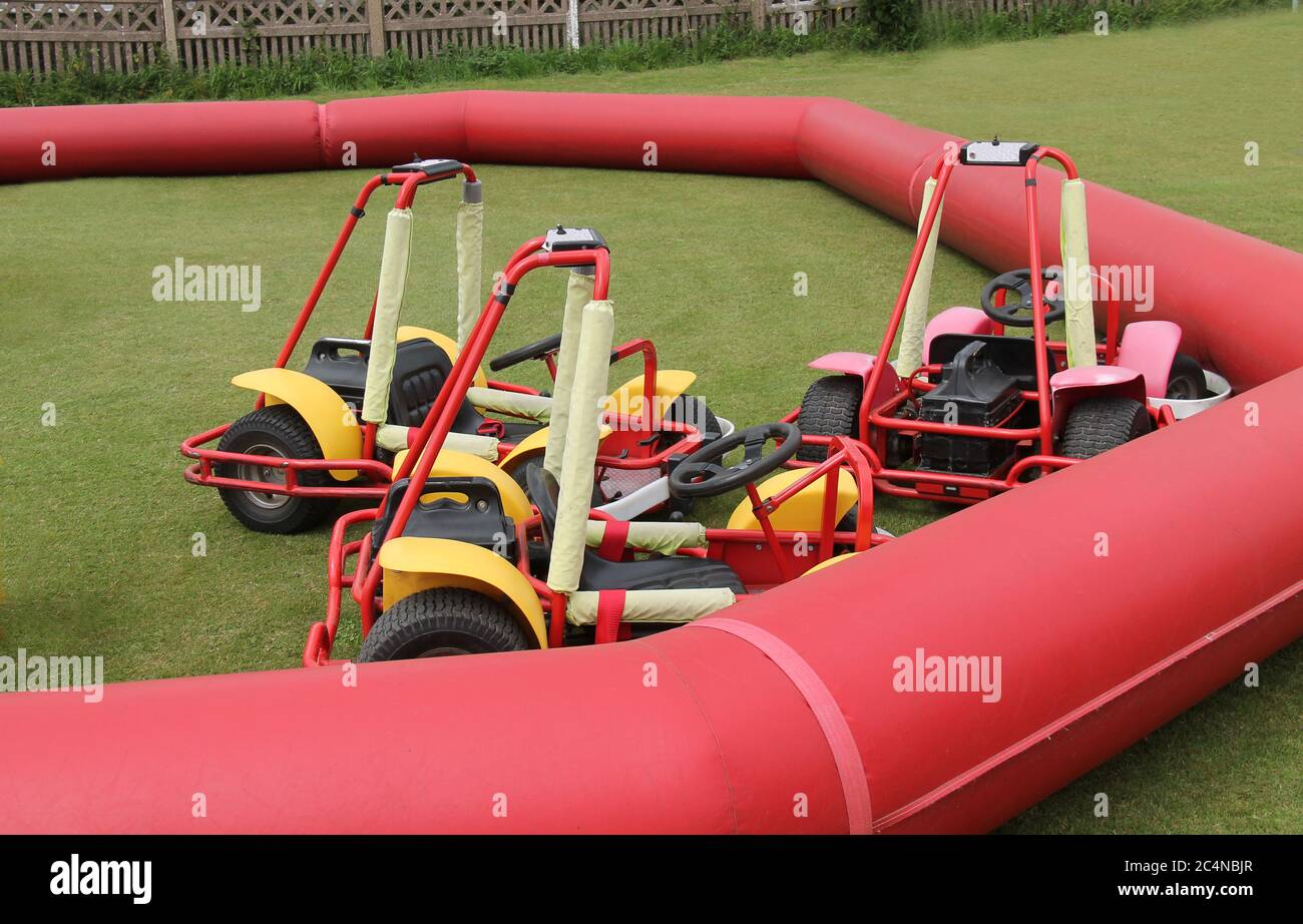 Single Racing Karts on a Fun Fair Grass Track Stock Photo - Alamy