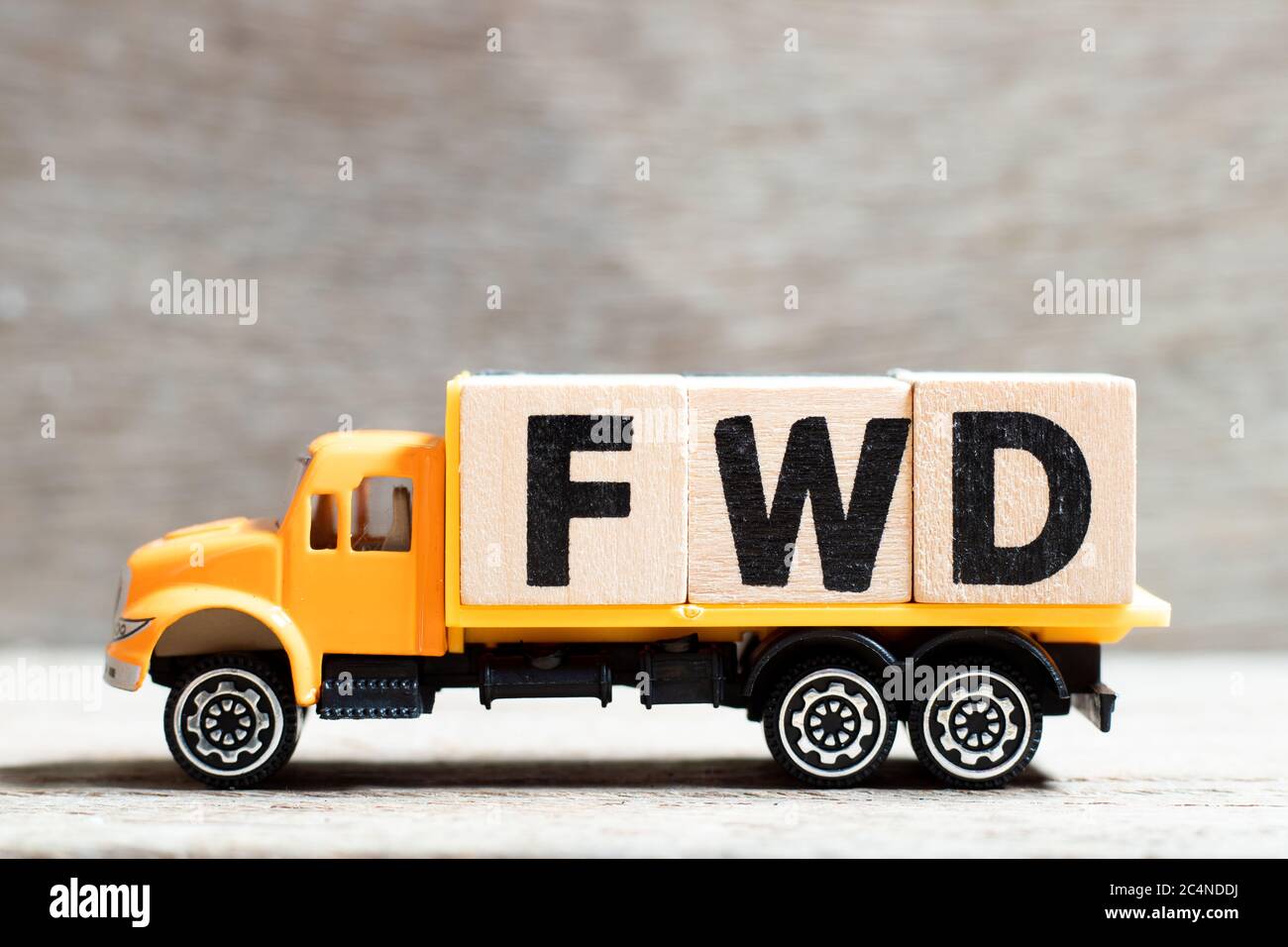 Truck hold letter block in word FWD (Abbreviation of forward) on wood ...