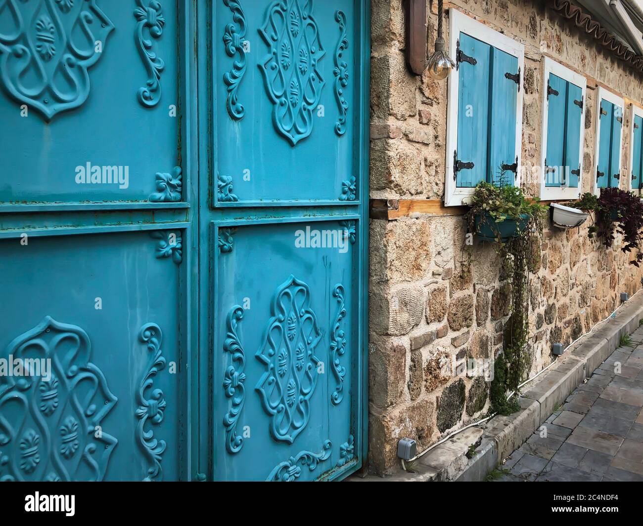 Turquoise gate and shutters of an old house in old town of Antalya ...