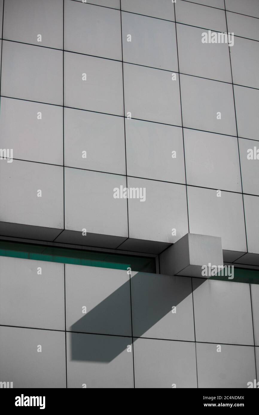 Modern styled gray building with geometric shapes Stock Photo - Alamy