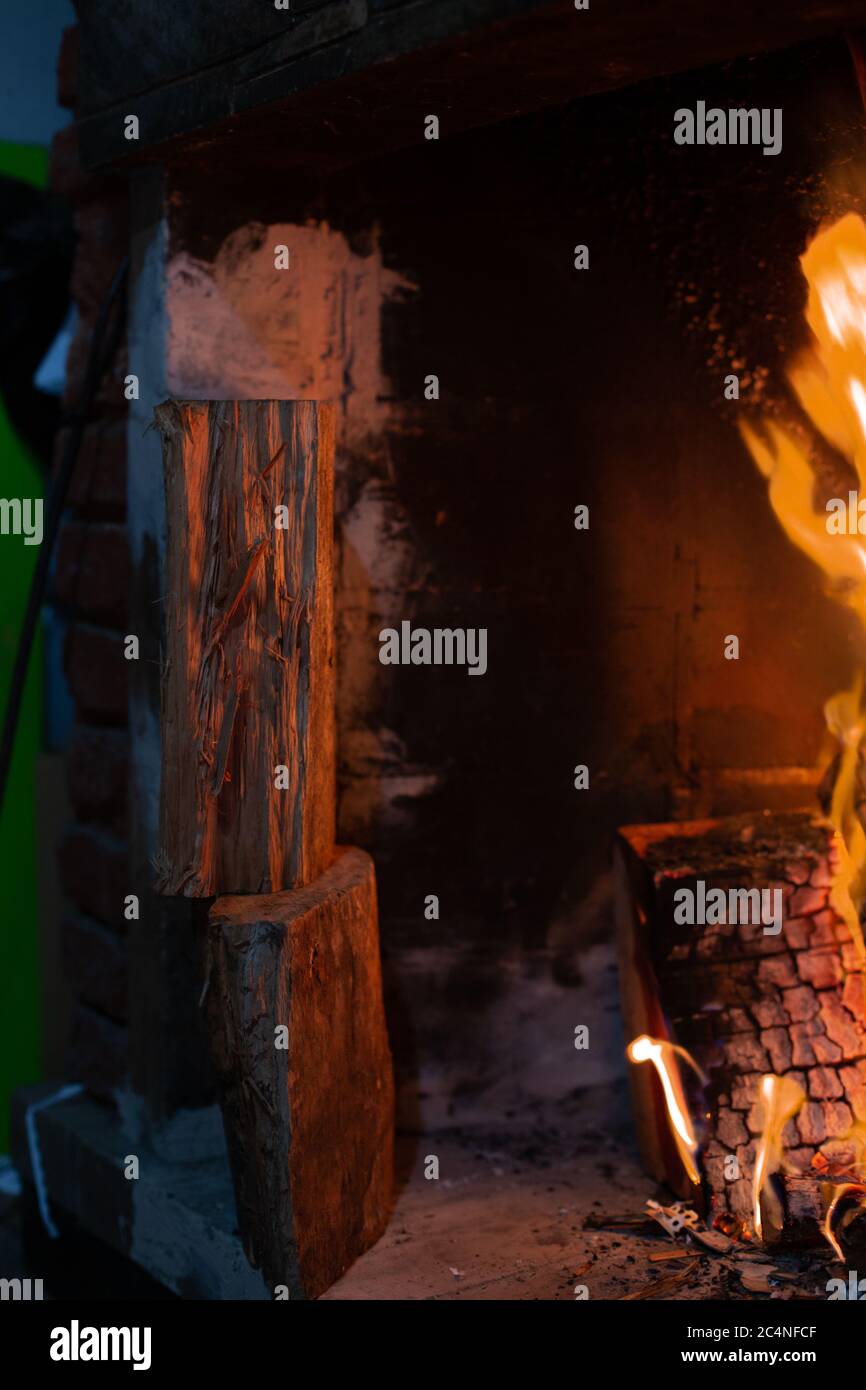 Stone stove with burning charcoal at night time Stock Photo - Alamy