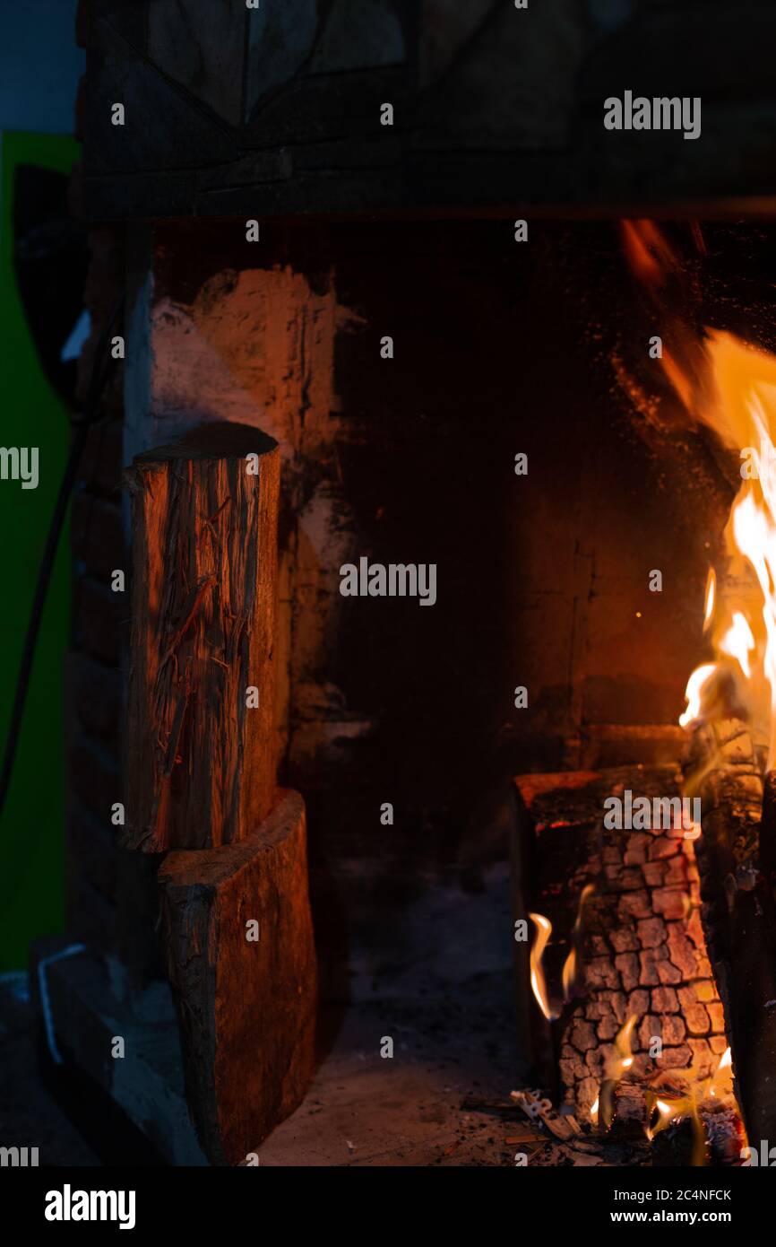 Stone stove with burning charcoal at night time Stock Photo - Alamy