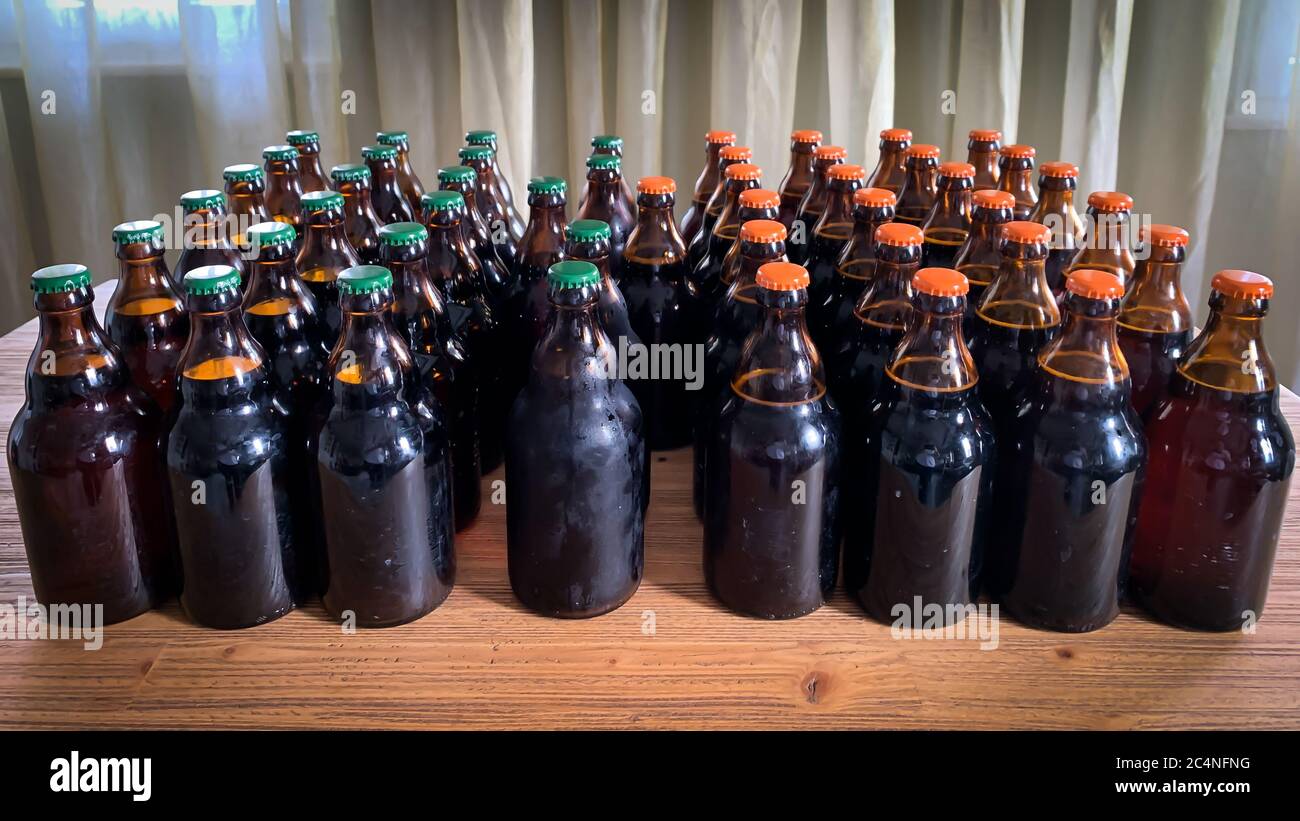 Row craft beer bottles table hi-res stock photography and images - Alamy
