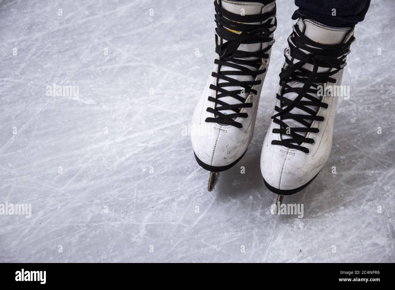 Female legs in ice skates, Ice skater on the skating rink Stock Photo ...
