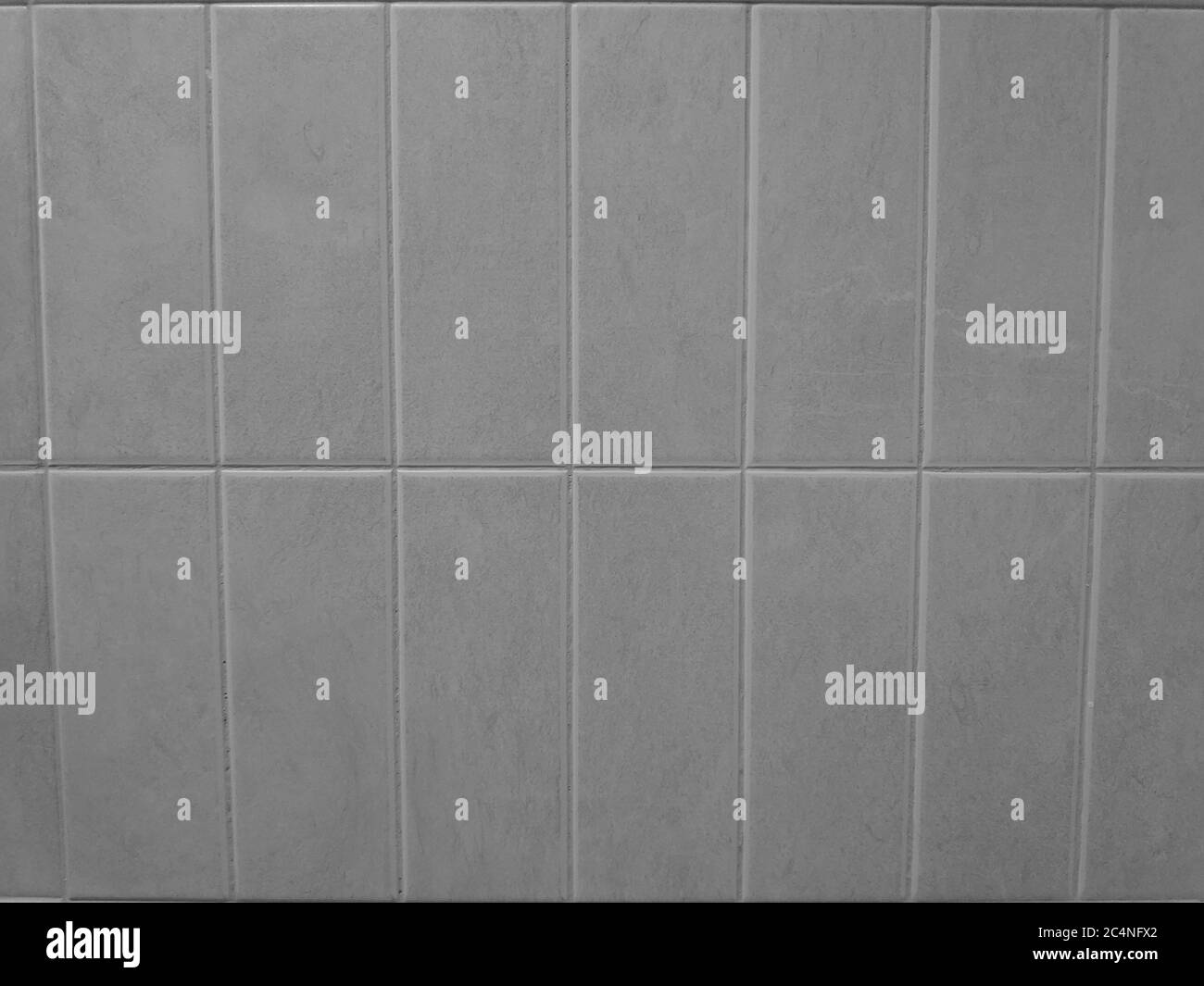 High angle shot of wall with grey tiles Stock Photo - Alamy