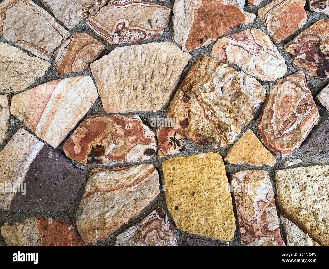 Brown yellow stone wall floor texture background Stock Photo - Alamy
