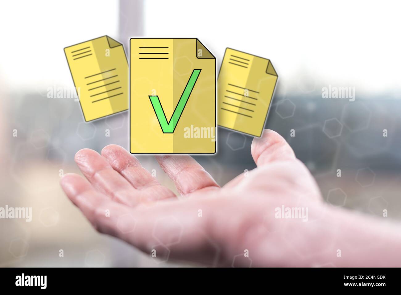 Document validation concept above a hand of a man Stock Photo - Alamy