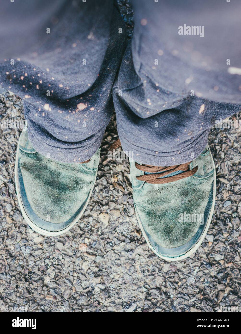 Vertical high angle shot of a person's feet wearing sports shoes Stock ...