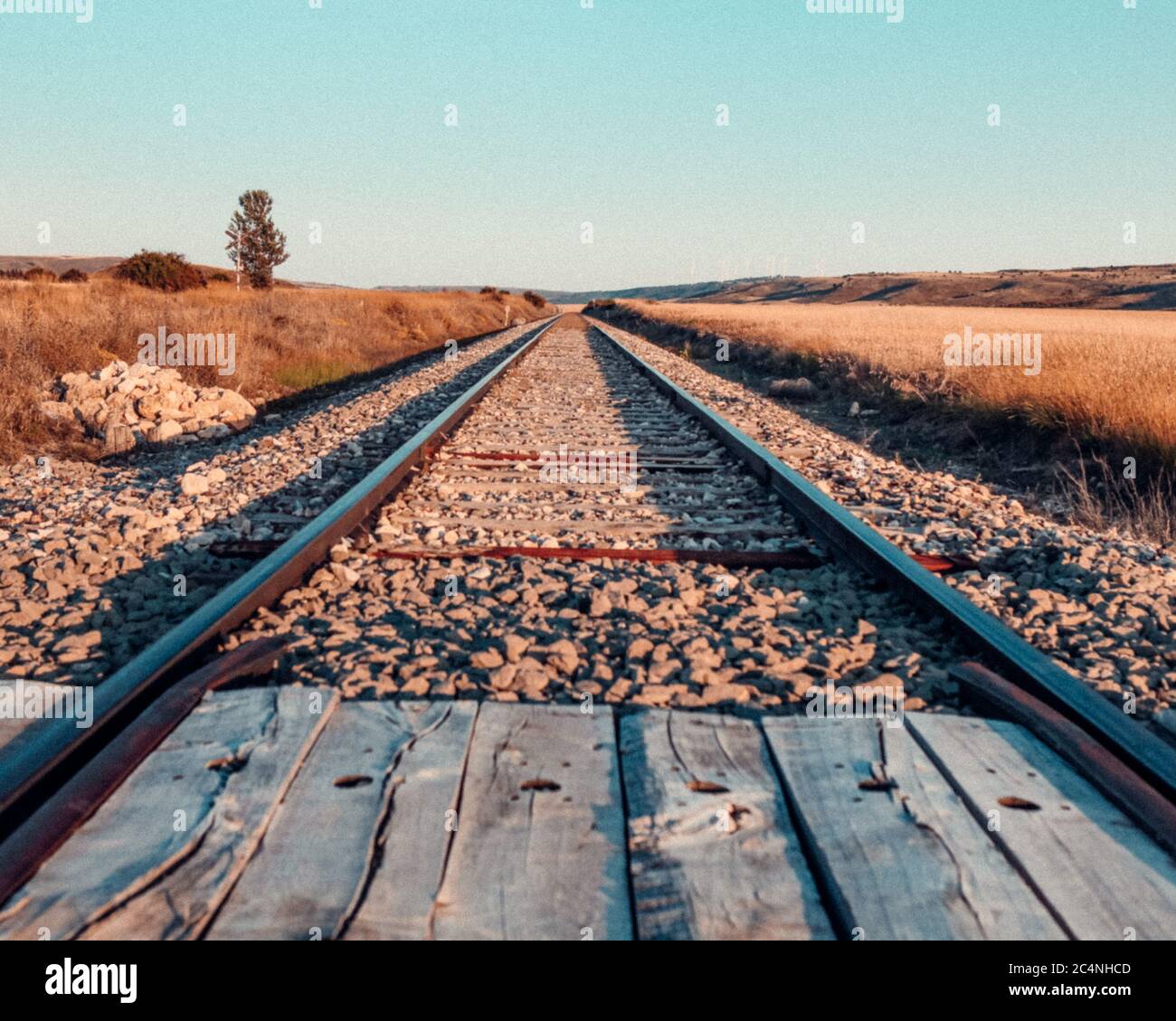 Railway track in brownfield Stock Photo - Alamy