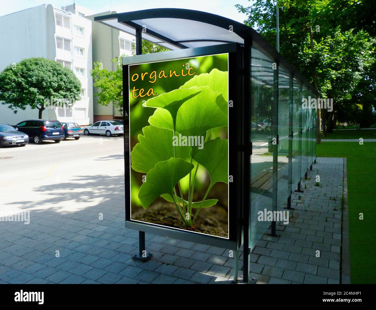 glass bus shelter at bus stop. mock-up background. green lawn and trees ...
