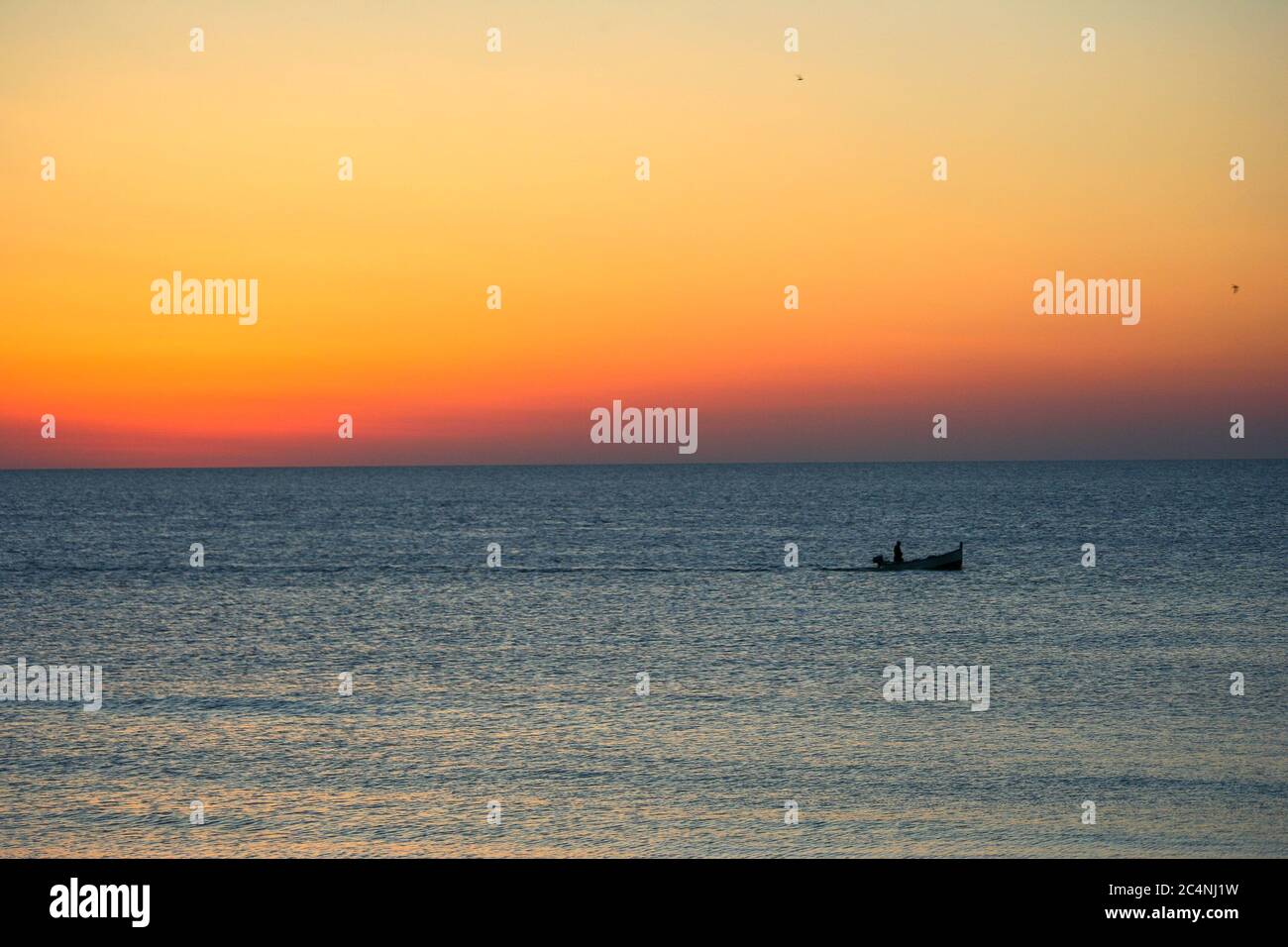 Sunset on the beach of Cefalu (Sicily / Italy Stock Photo - Alamy