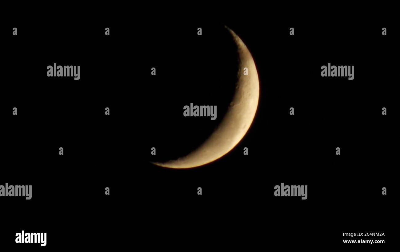 Beautiful crescent moon glowing in the dark Stock Photo - Alamy