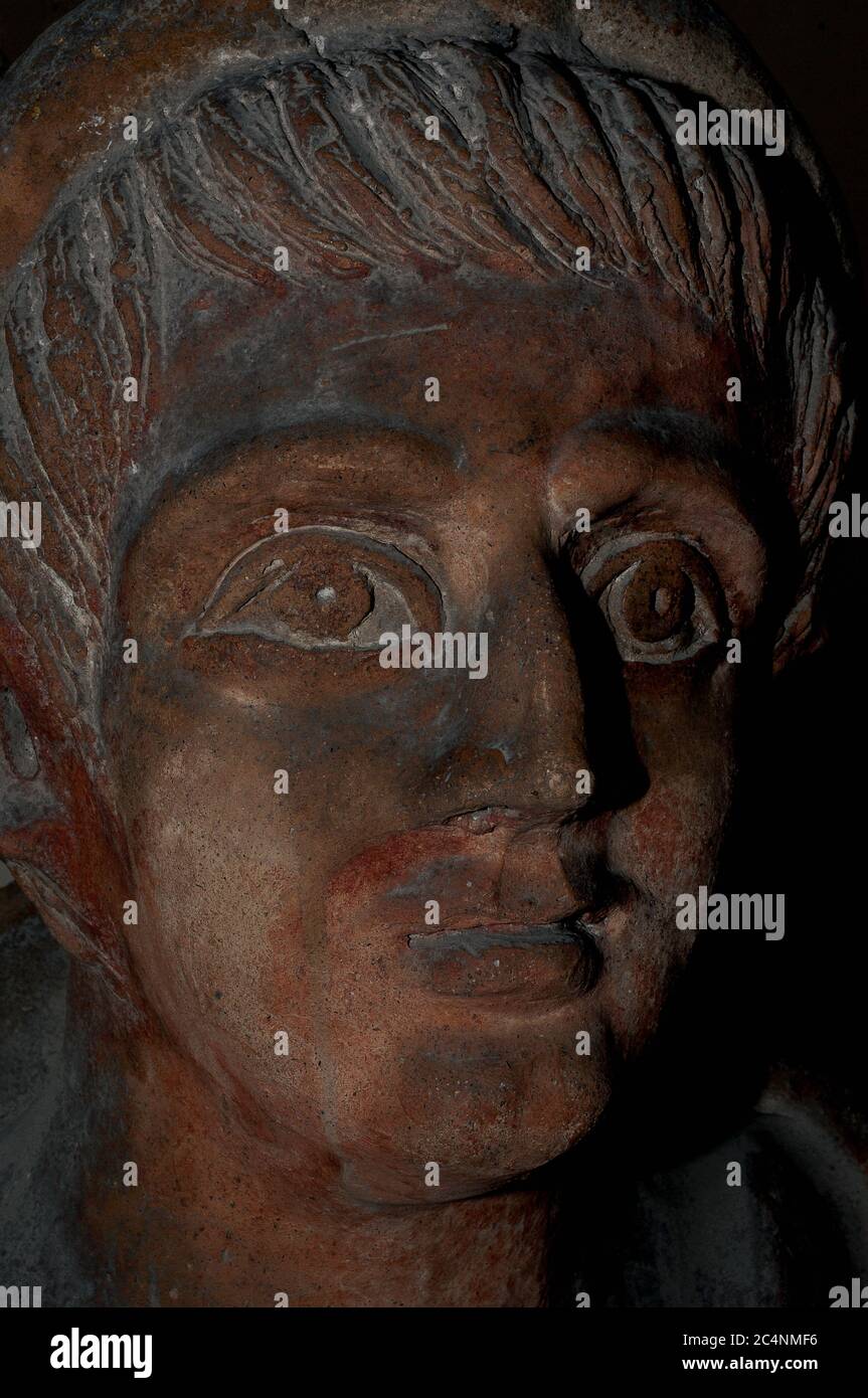 Face of young Etruscan man, interred more than 2,000 years ago. Stone ...