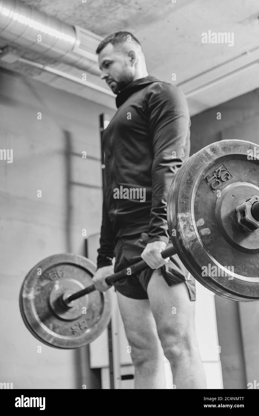 Young man during workout Black and White Stock Photos & Images - Alamy