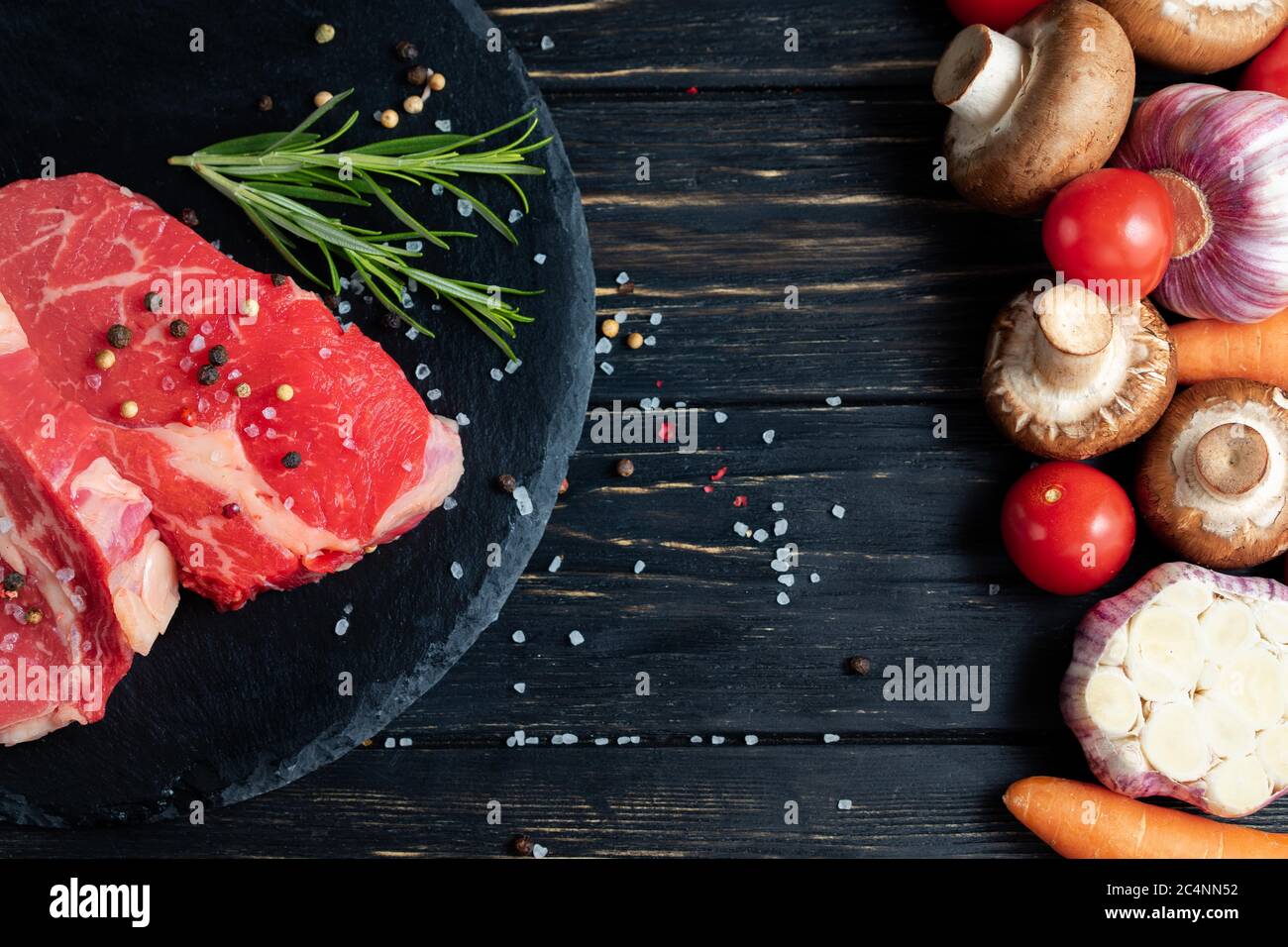 On one side of the table are vegetables on the other side of a ...