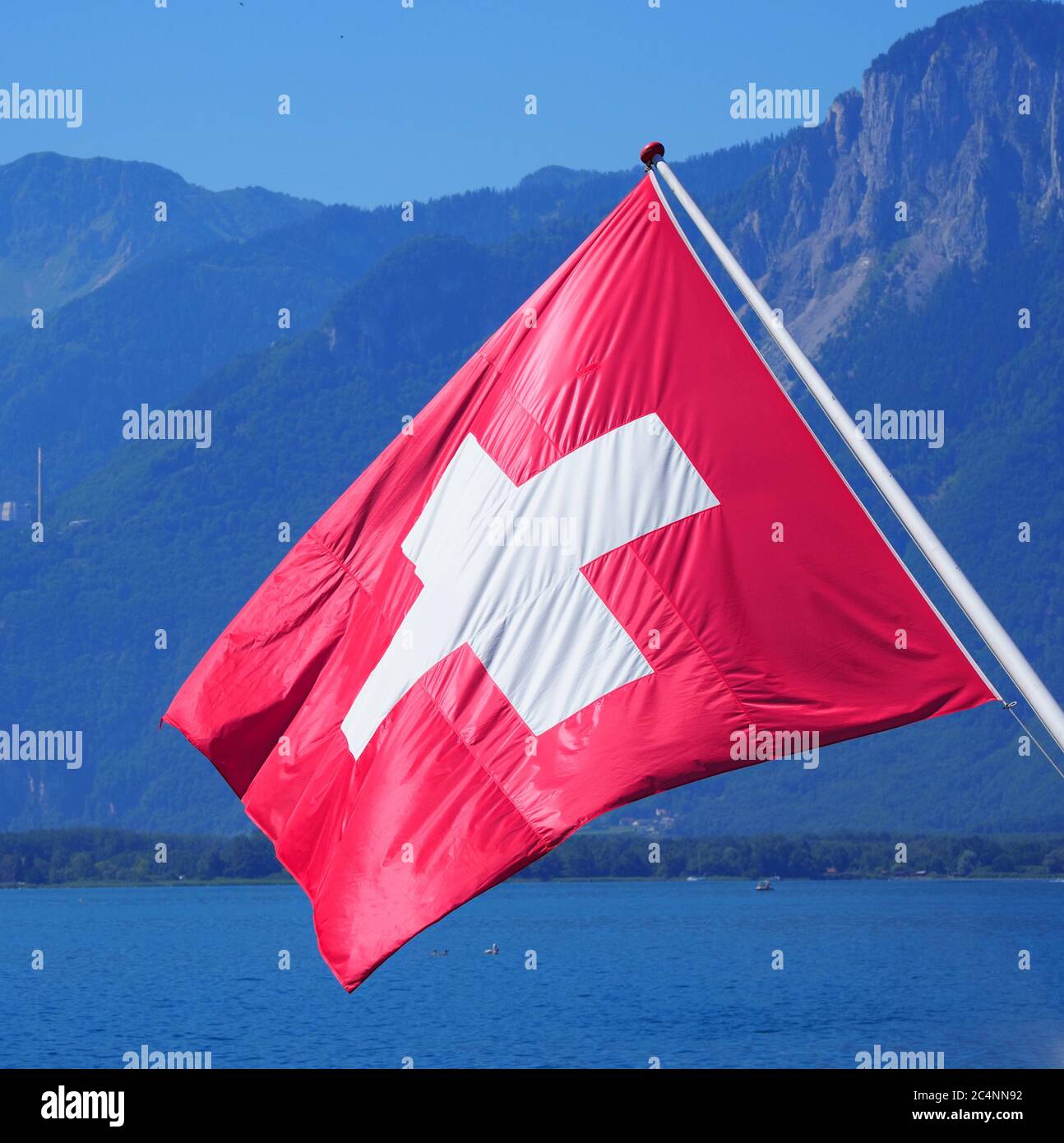 Red and white Swiss national flag at of Lake Geneva in Switzerland ...