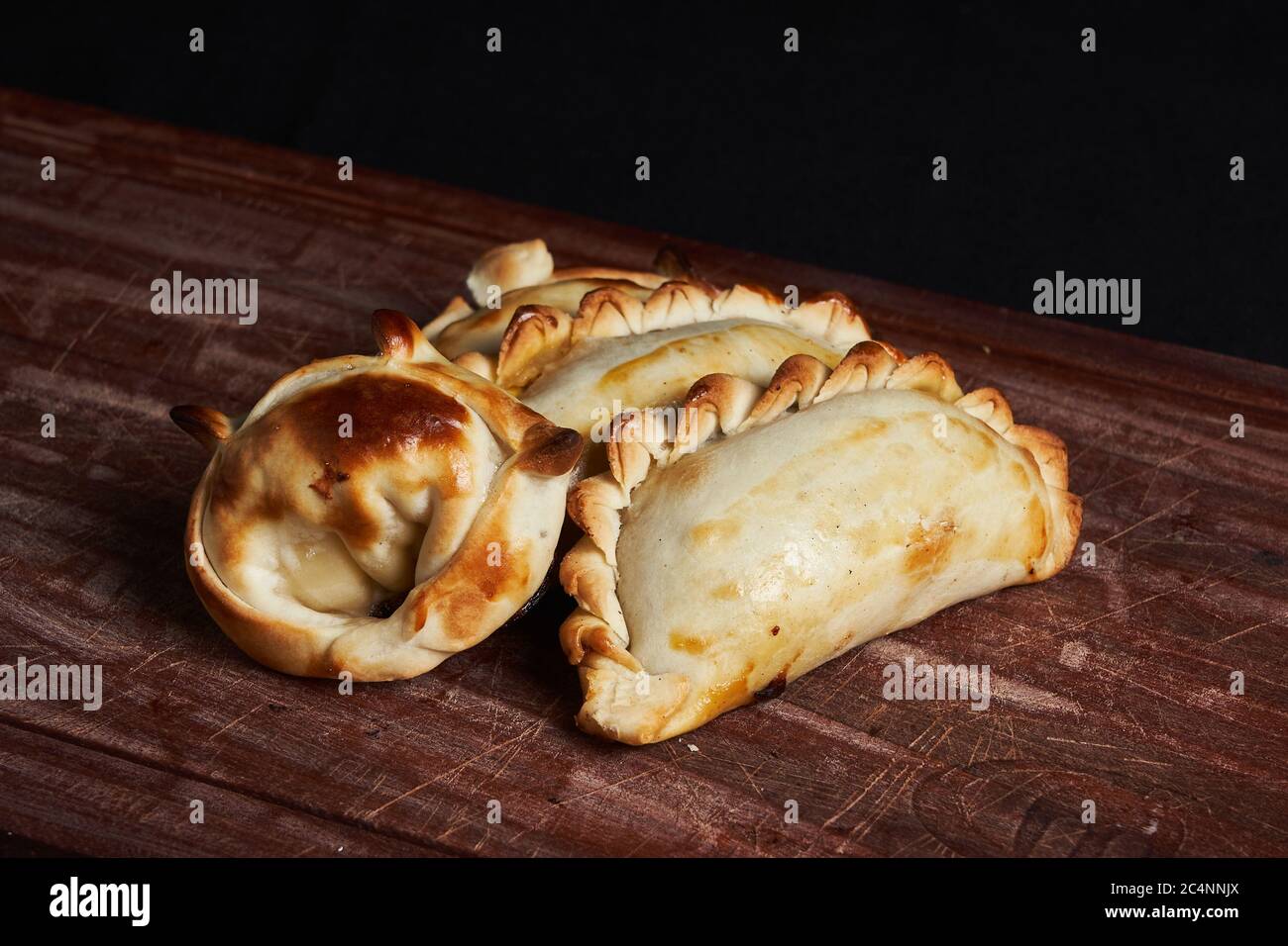 Freshly baked pies on the wooden tray Stock Photo - Alamy
