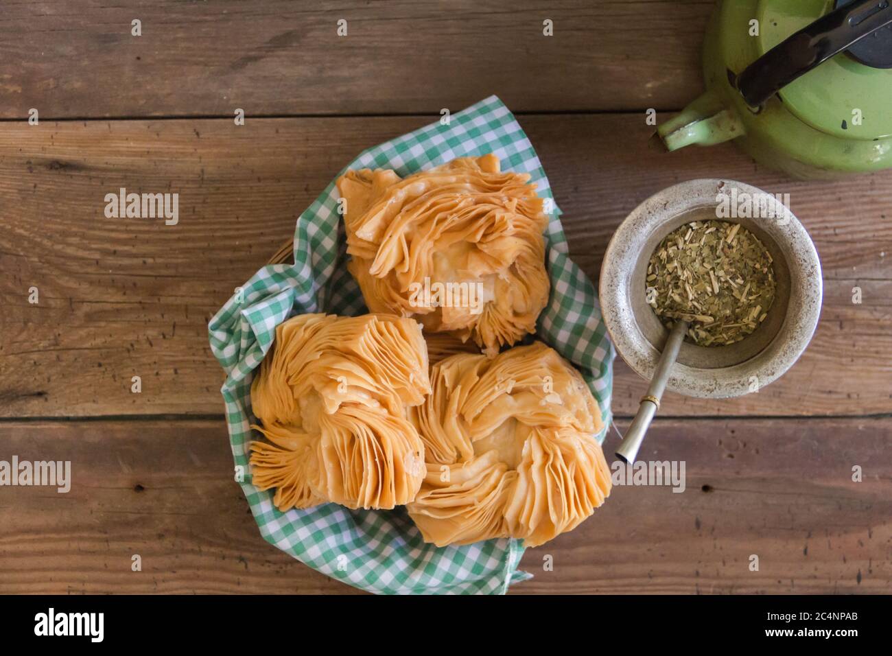 Overhead shot of mate and fried sweet potato and quince pastries Stock ...
