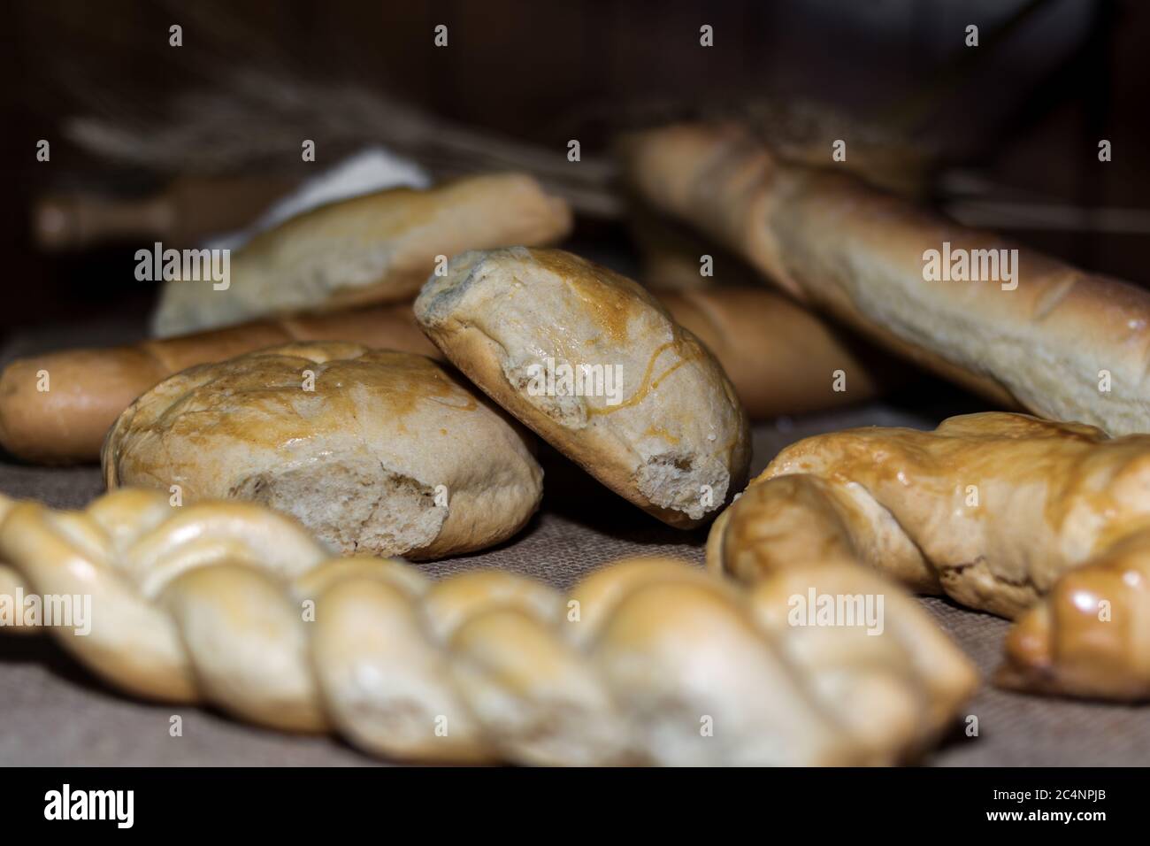 Selective focus of different types of bread on the table under the ...