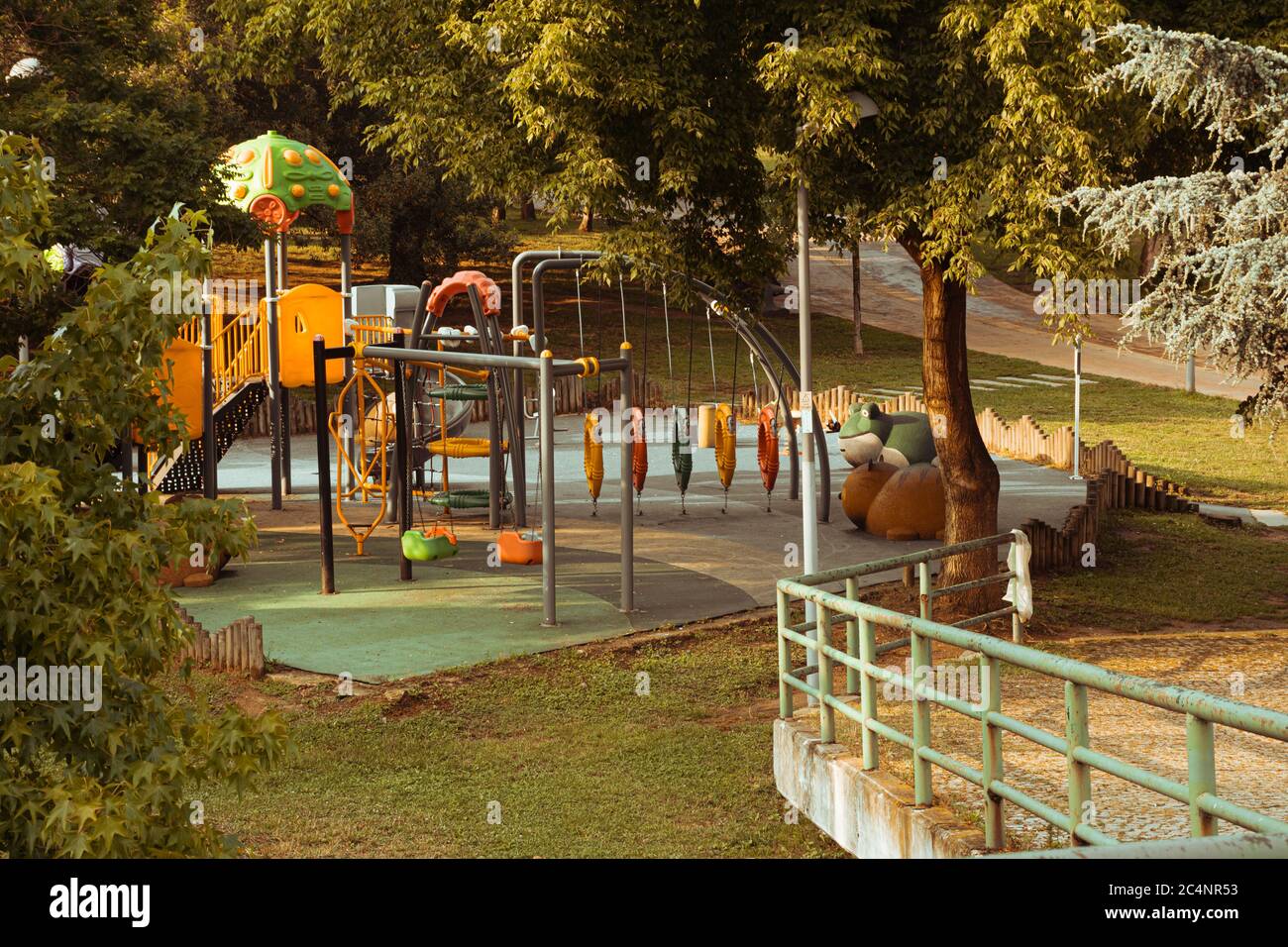 Playground without kids. Empty play area in the big park Stock Photo ...