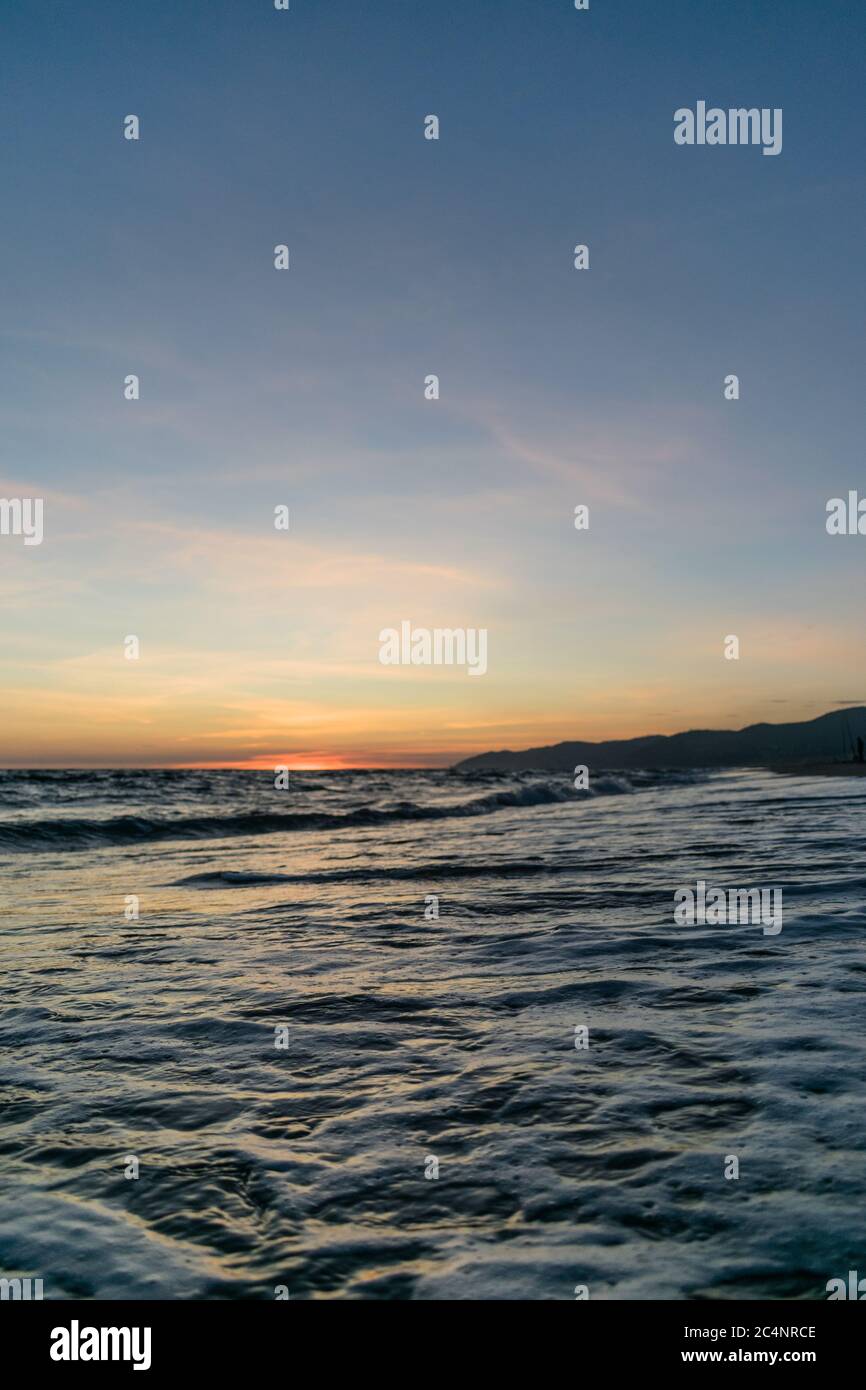 Beautiful sunset scenery ocean low hi-res stock photography and images ...