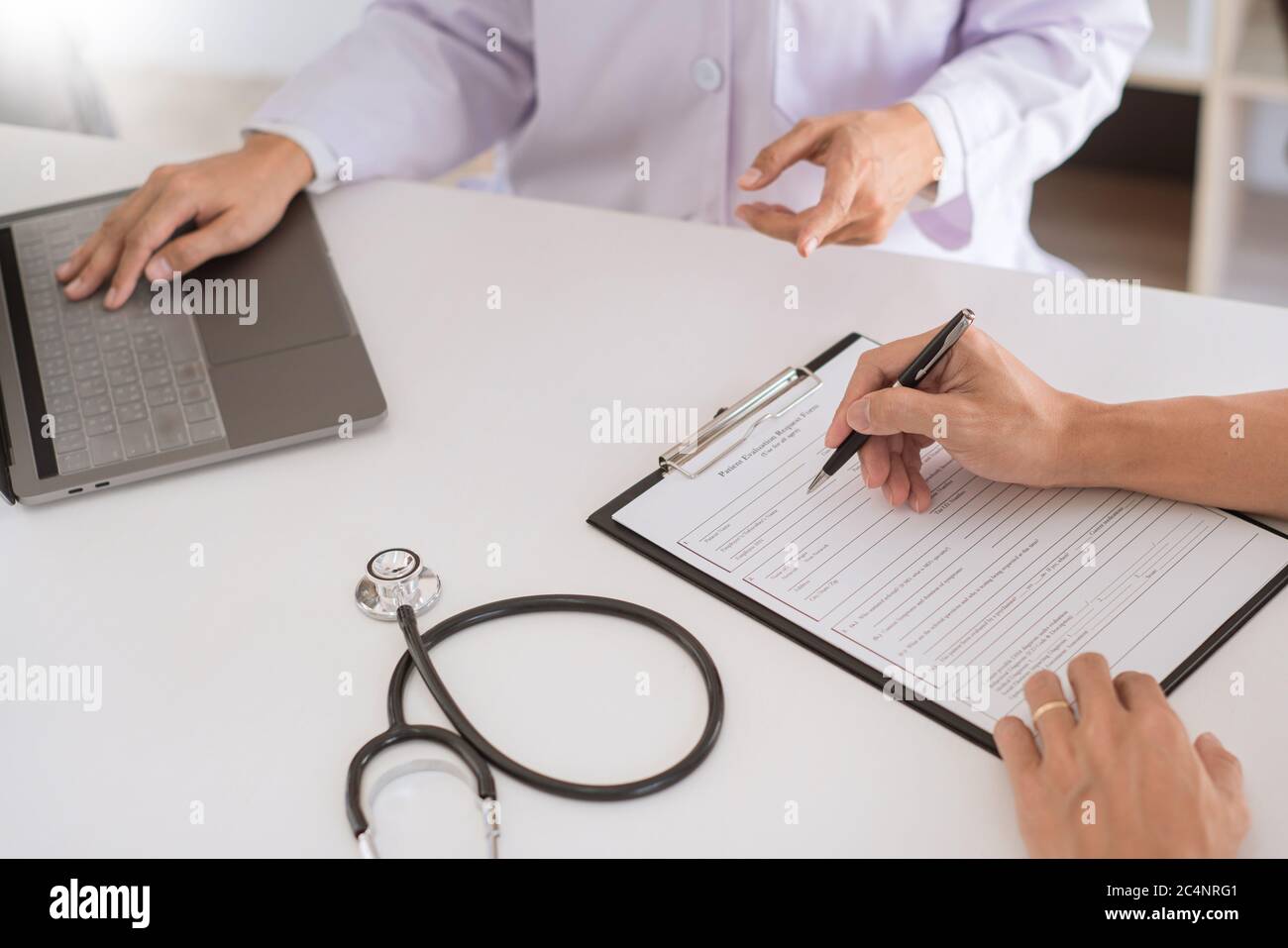 doctor giving consulting and diagnostic to patient and explaining ...
