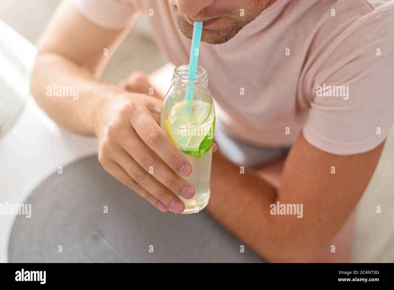 Man drink through a straw hi-res stock photography and images - Alamy