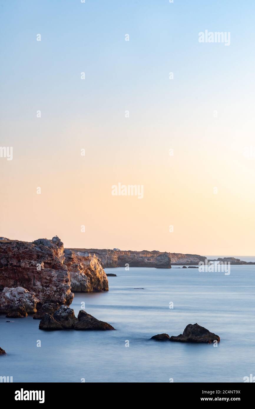 the rocks on the beach on a beautiful summer day and the sky is blue ...