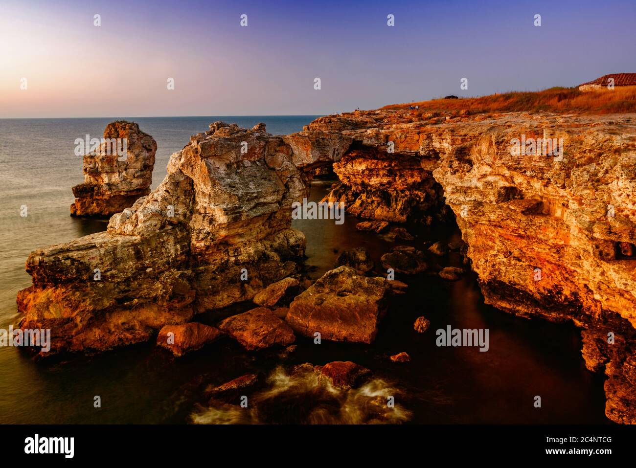 the rocks on the beach on a beautiful summer day and the sky is blue ...