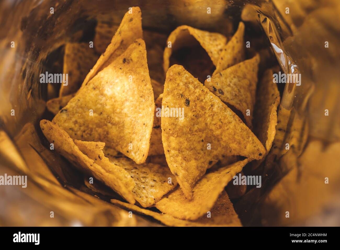 Closeup shot of triangular potato chips in a bag Stock Photo - Alamy