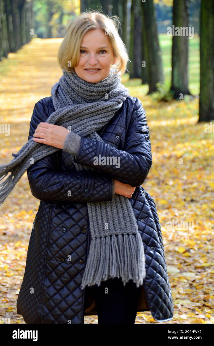 middle aged woman enjoy the nature during a walk Stock Photo - Alamy