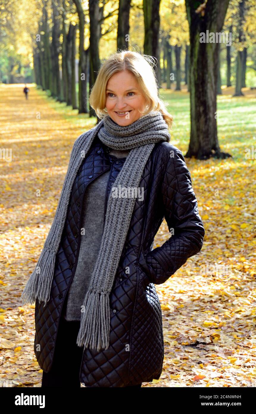 middle aged woman enjoy the nature during a walk Stock Photo - Alamy